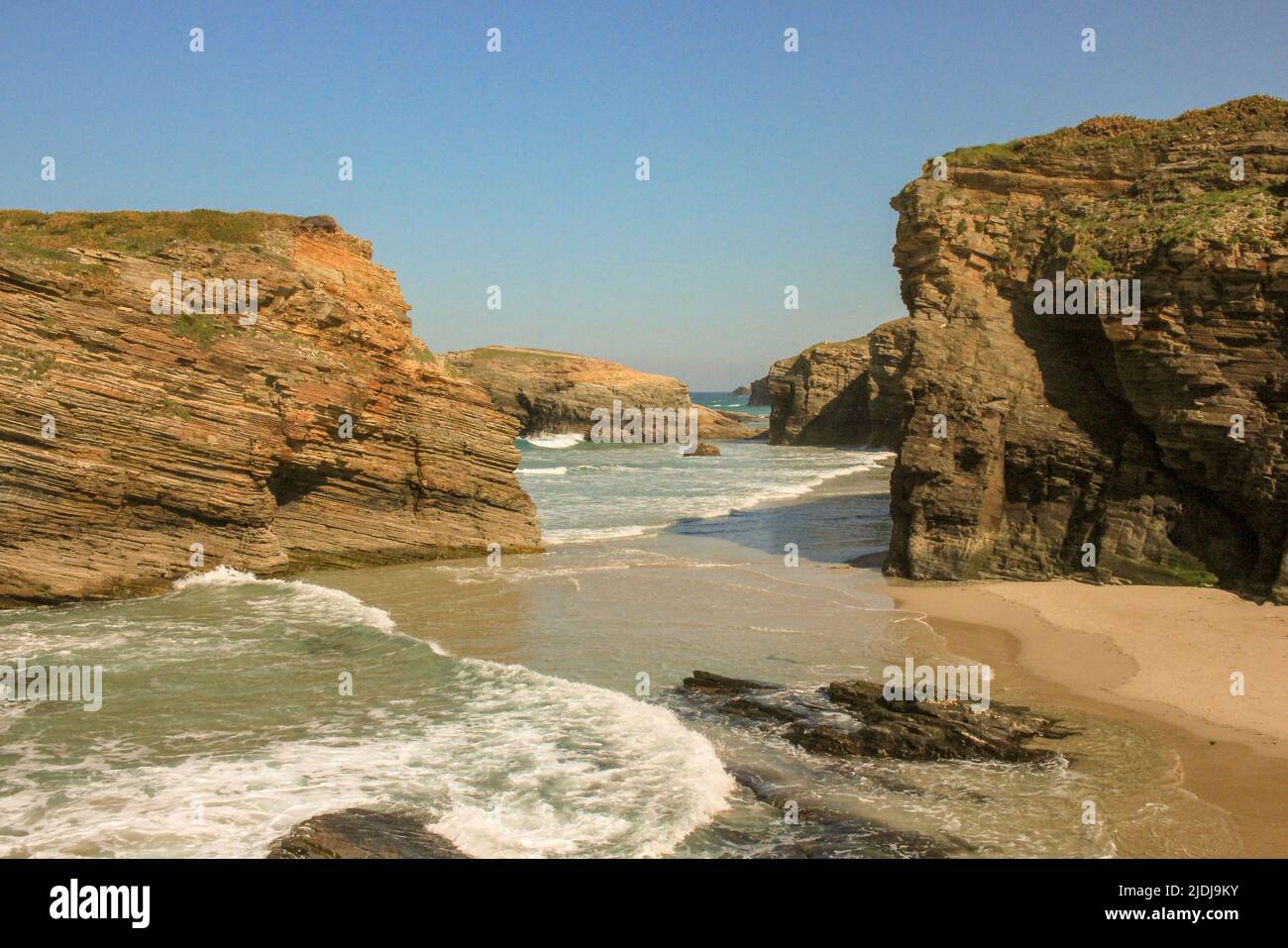 a day on the beach among the rocks and cold water Stock Photo - Alamy