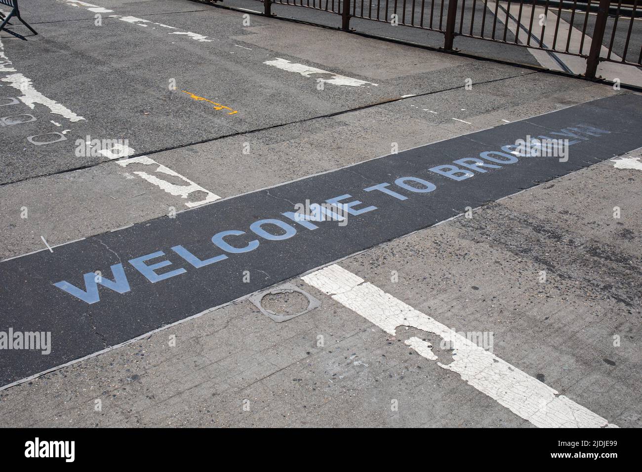 Welcome to Brooklyn. Text on the Brooklyn end of Brooklyn Bridge ...