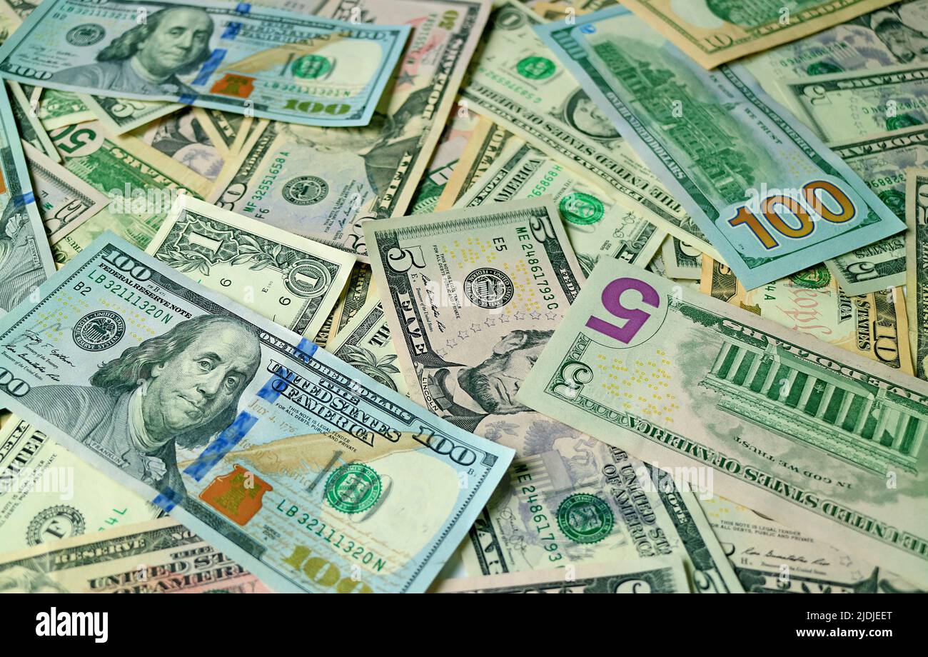 Closeup heap of United States dollar bills for the concept of business ...