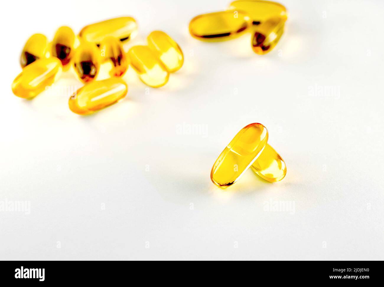 Oily fish, in capsules, on a white background Stock Photo - Alamy