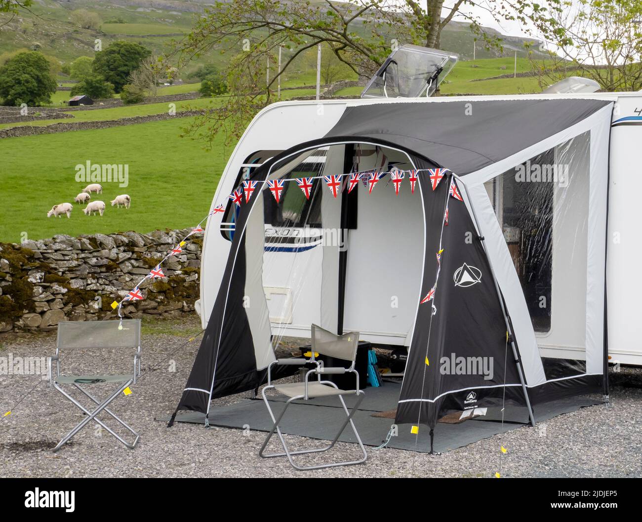 Bunting on a caravan awning in Austwick, UK Stock Photo - Alamy