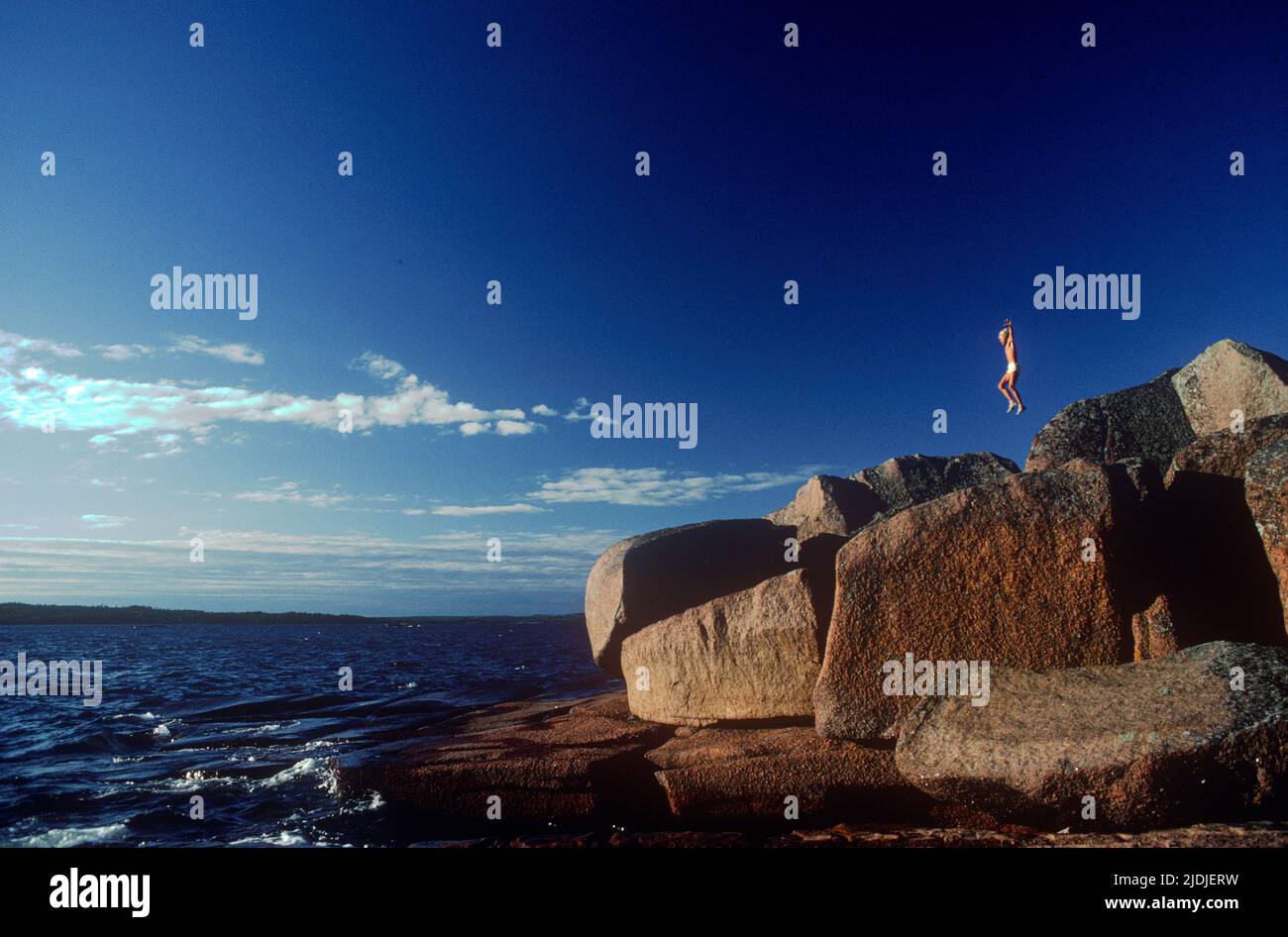 Man jumping on rocks hi-res stock photography and images - Alamy
