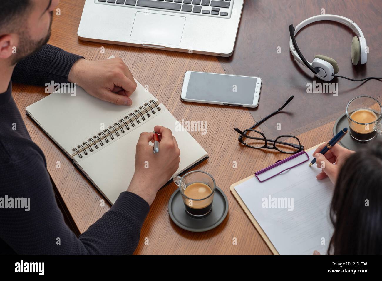 Teamwork two people working working together hi-res stock photography ...