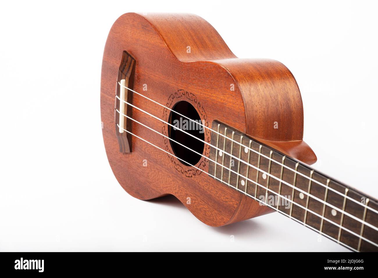 Wooden ukulele guitar isolated over white background Stock Photo - Alamy