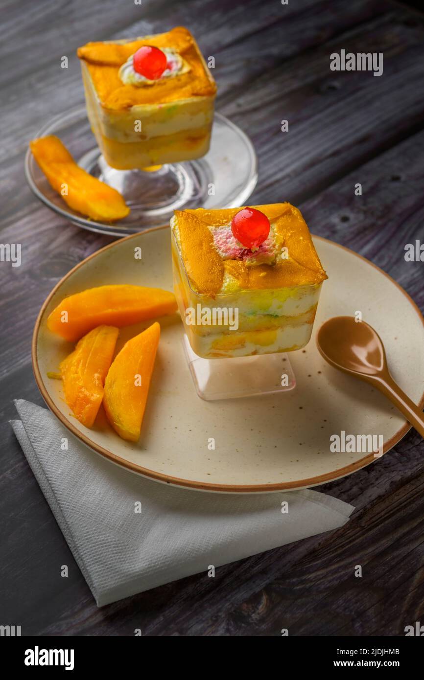 Mango mousse on a plate with copy space Stock Photo - Alamy
