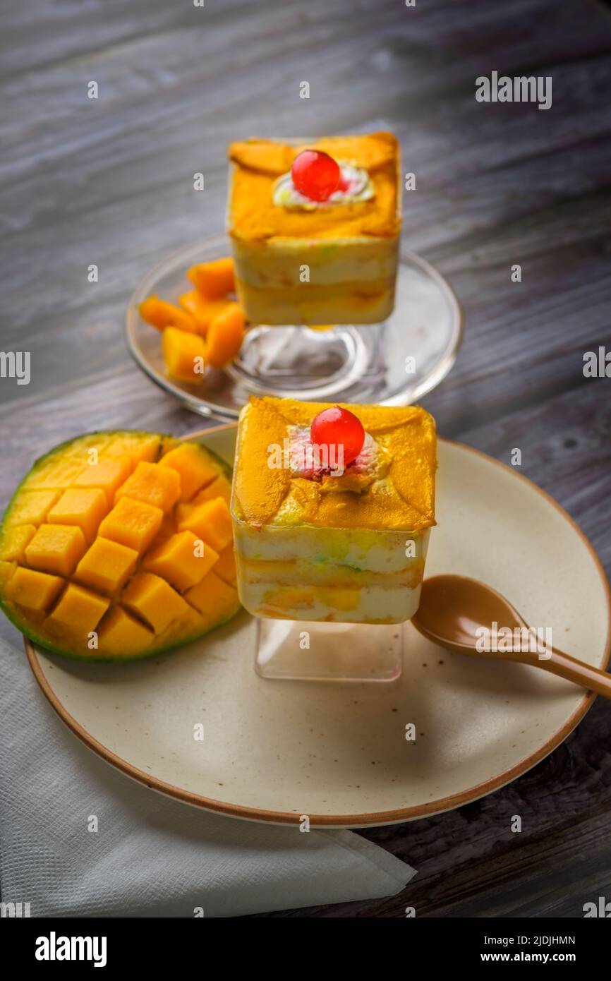 Mango mousse on a plate with copy space Stock Photo - Alamy