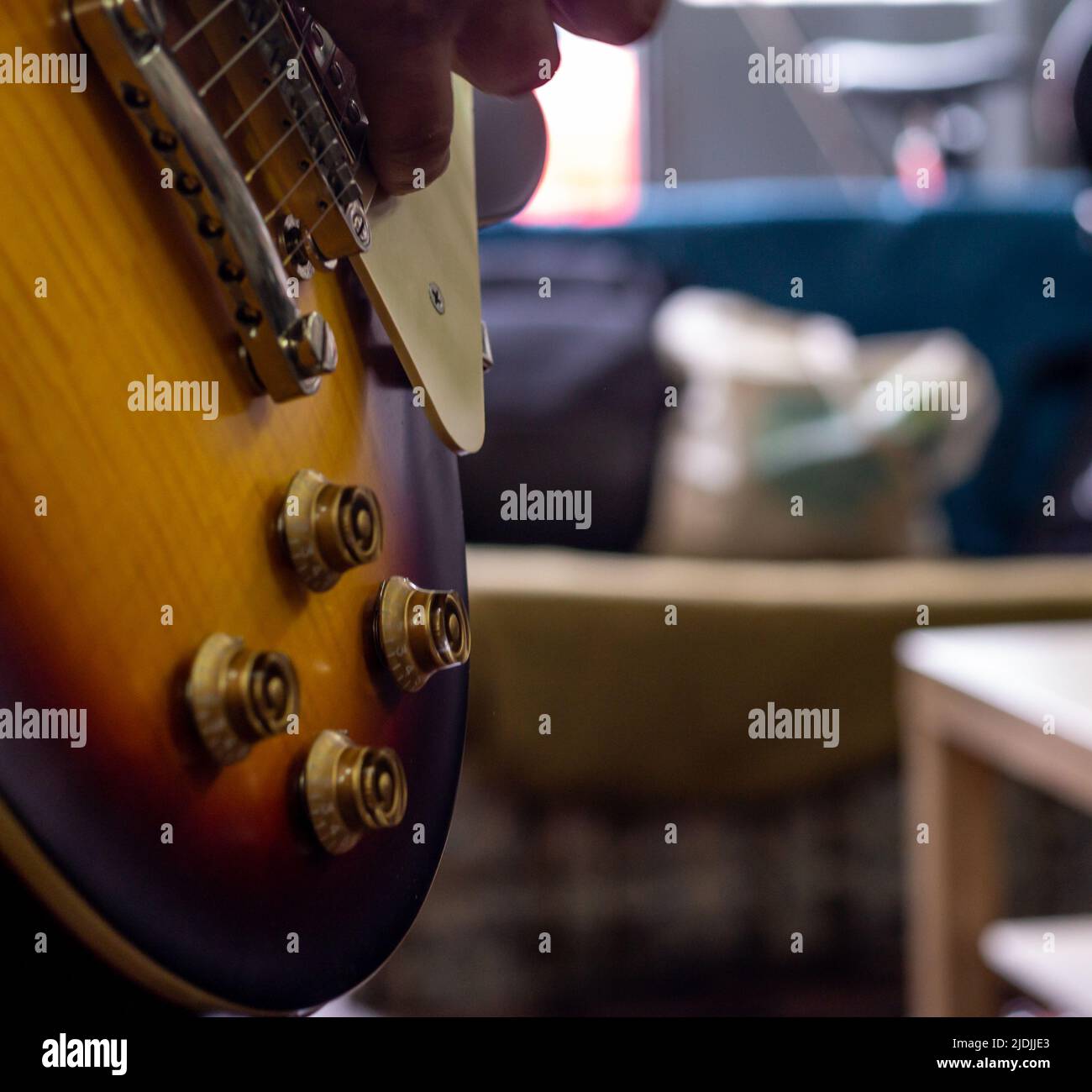 man's hand playing electric guitar Stock Photo - Alamy
