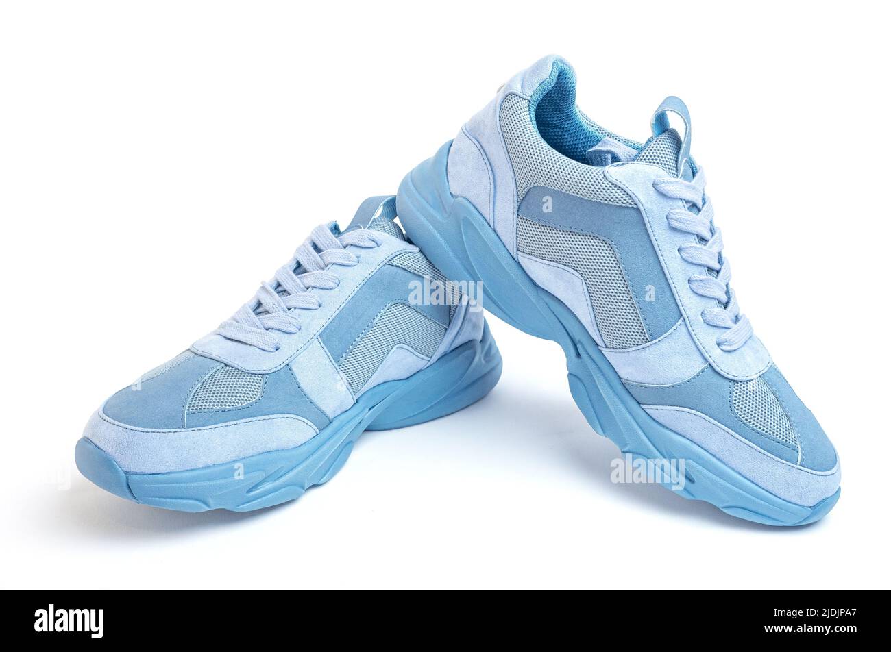 Light blue sneakers on a white background. Sports shoes Stock Photo - Alamy