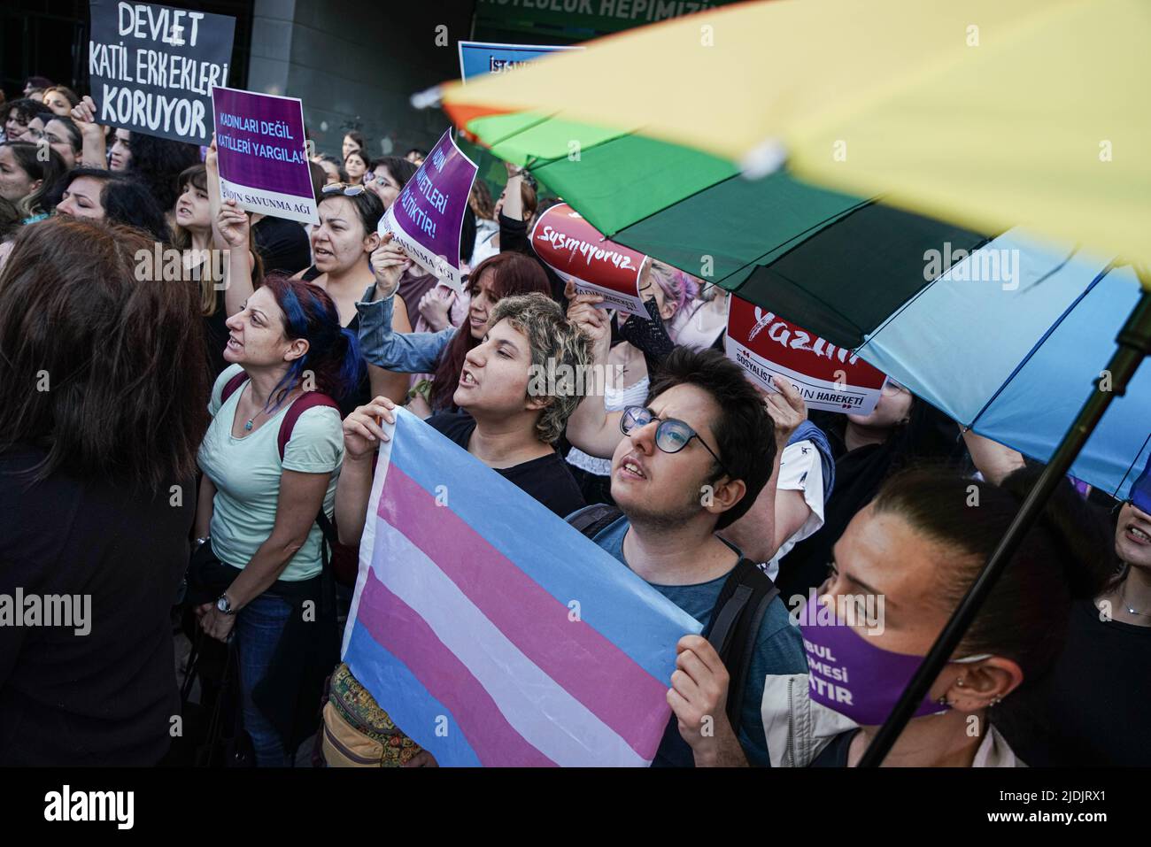 Protesters hold trans flags during the demonstration. Women's ...