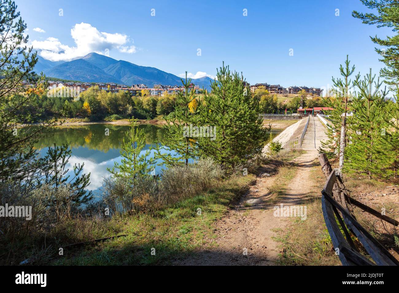 Bansko, Bulgaria summer panorama with Krinets dam, bridge to cafe and ...