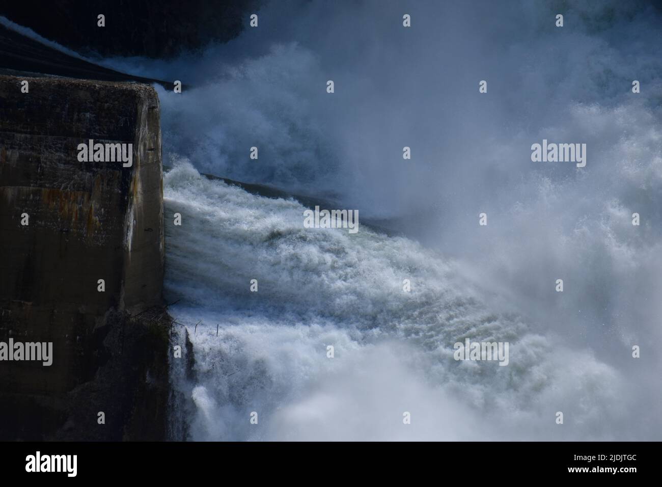 Water rushing from a dam Stock Photo - Alamy