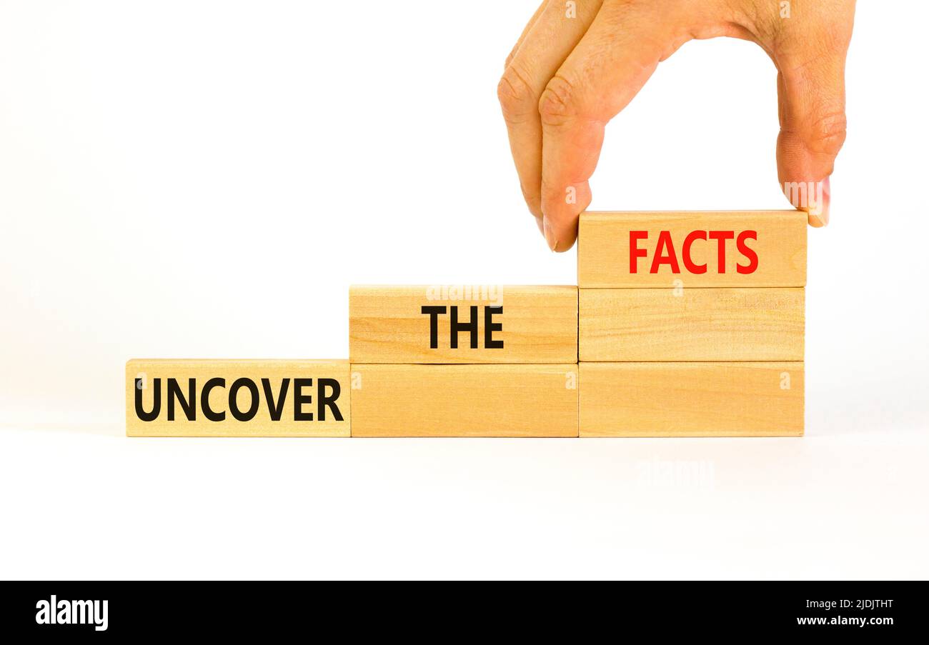 Uncover the facts symbol. Concept words Uncover the facts on wooden ...