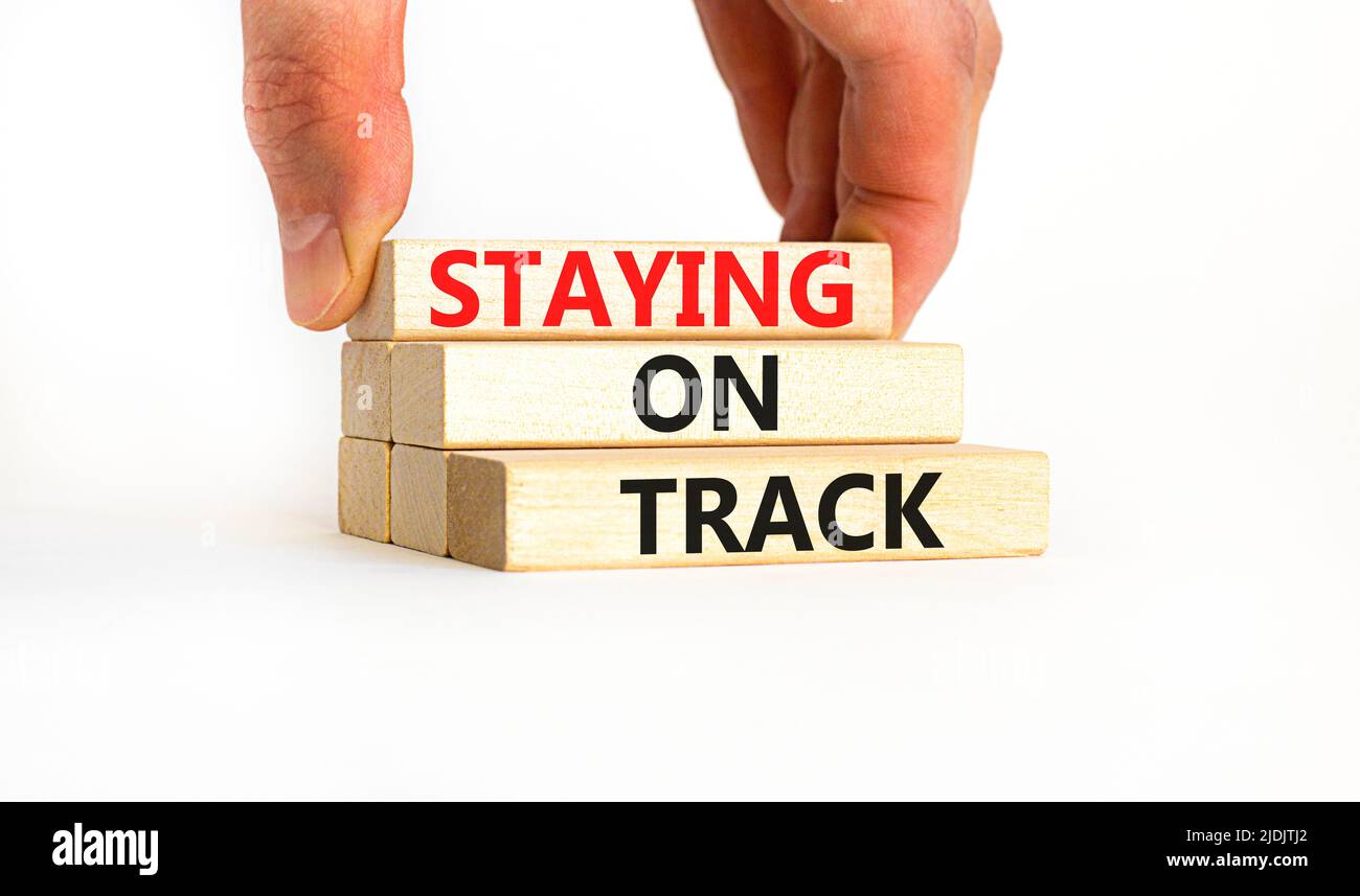 Staying on track symbol. Concept words Staying on track on wooden ...