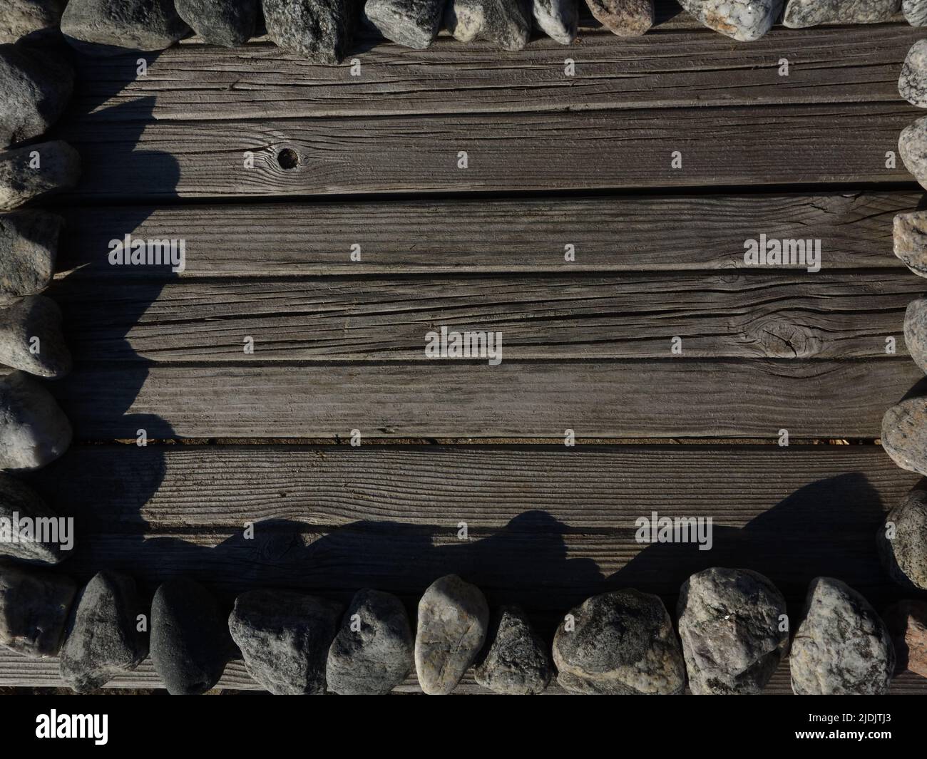 Stone frame with wood as a background Stock Photo - Alamy