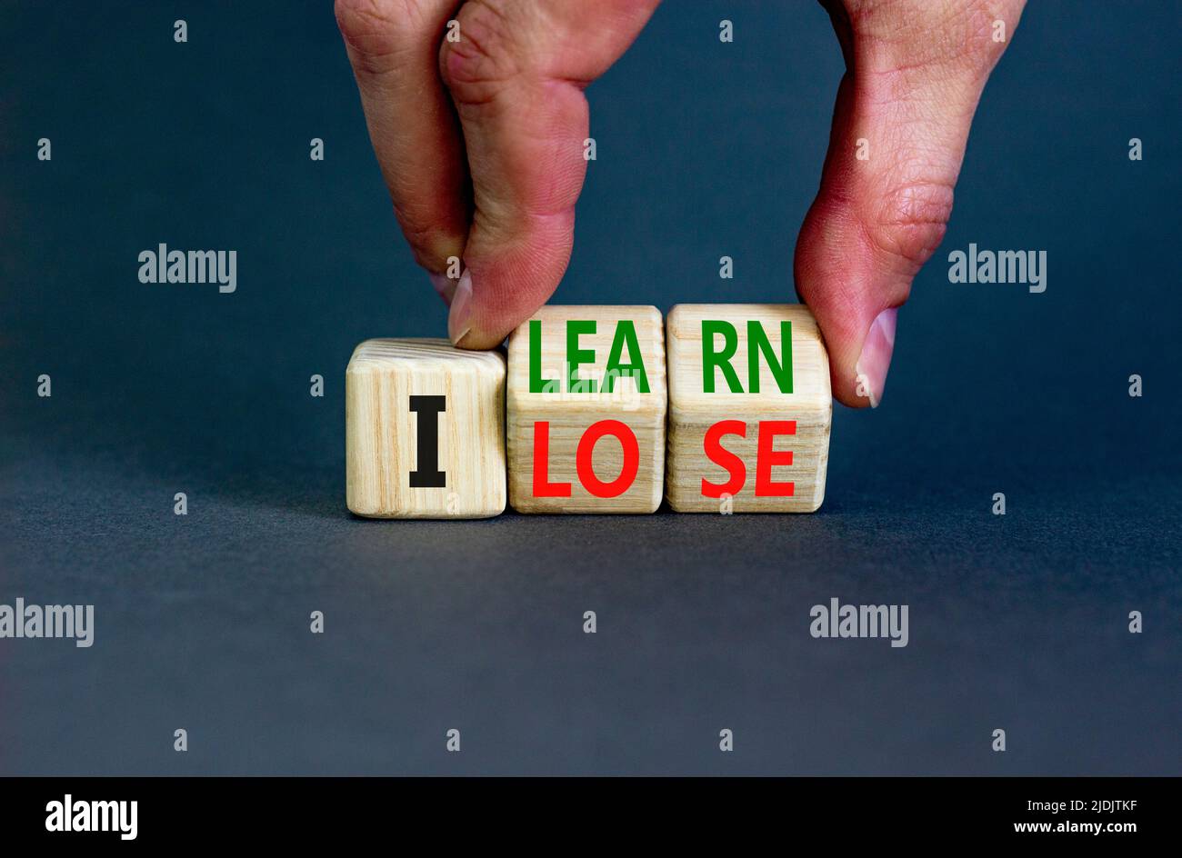 I learn or lose symbol. Concept words I learn and I lose on wooden ...