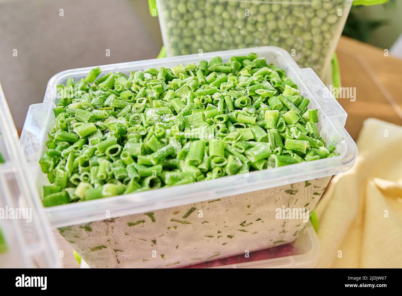 Frozen vegetables and fruits, close-up frozen green onions, peas Stock ...