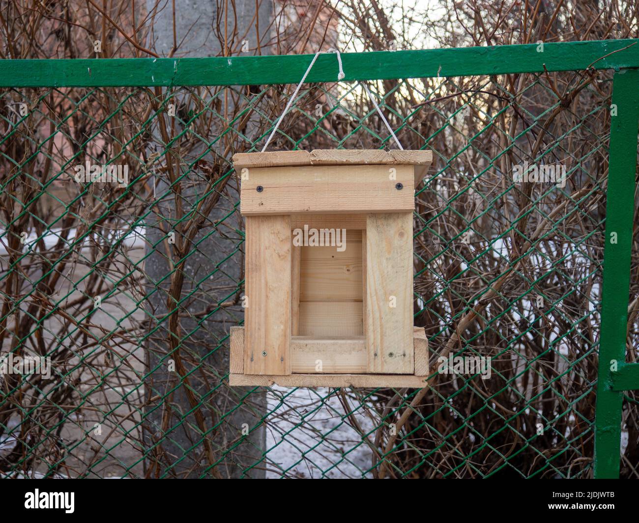 bird feeders. Winter street. Architecture. Caring for animals Stock ...