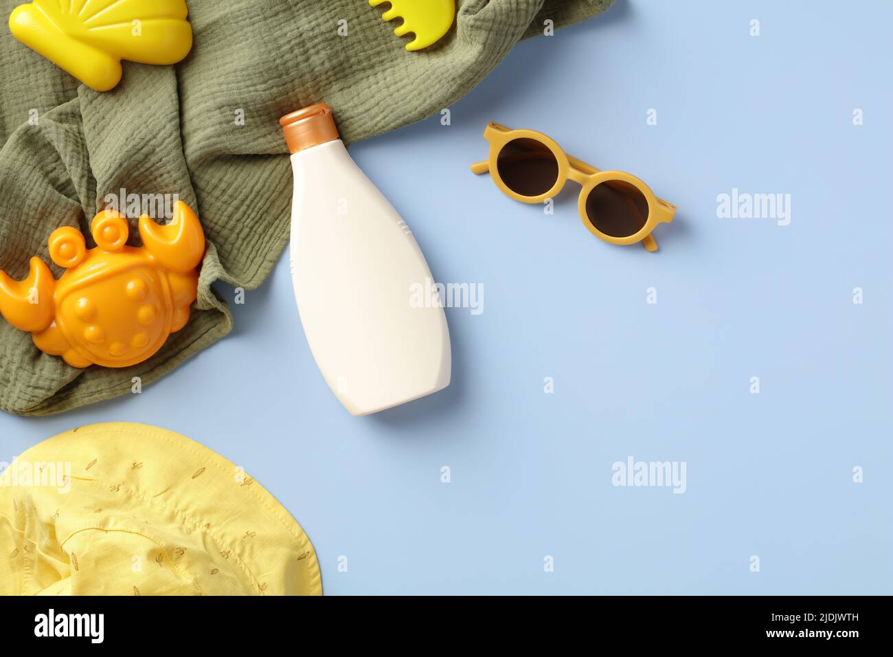 Flat lay baby sunscreen and summer accessories on blue background Stock ...