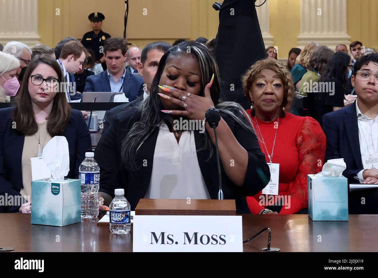 Georgia election worker Shaye Moss (Front) gestures while testifying ...