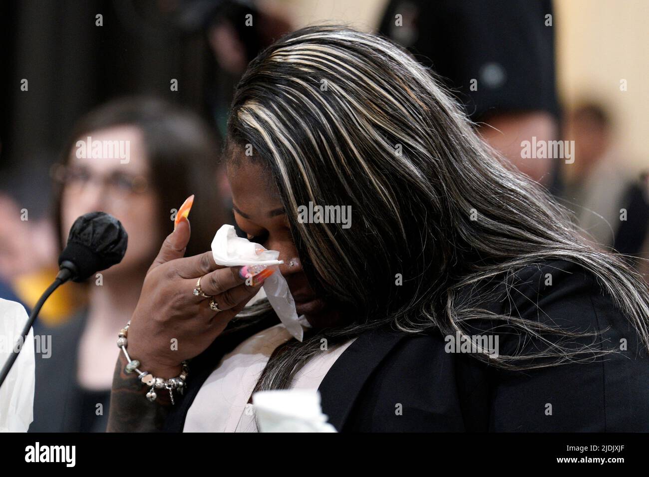 Wandrea ArShaye “Shaye” Moss, former Georgia election worker, wipes her ...