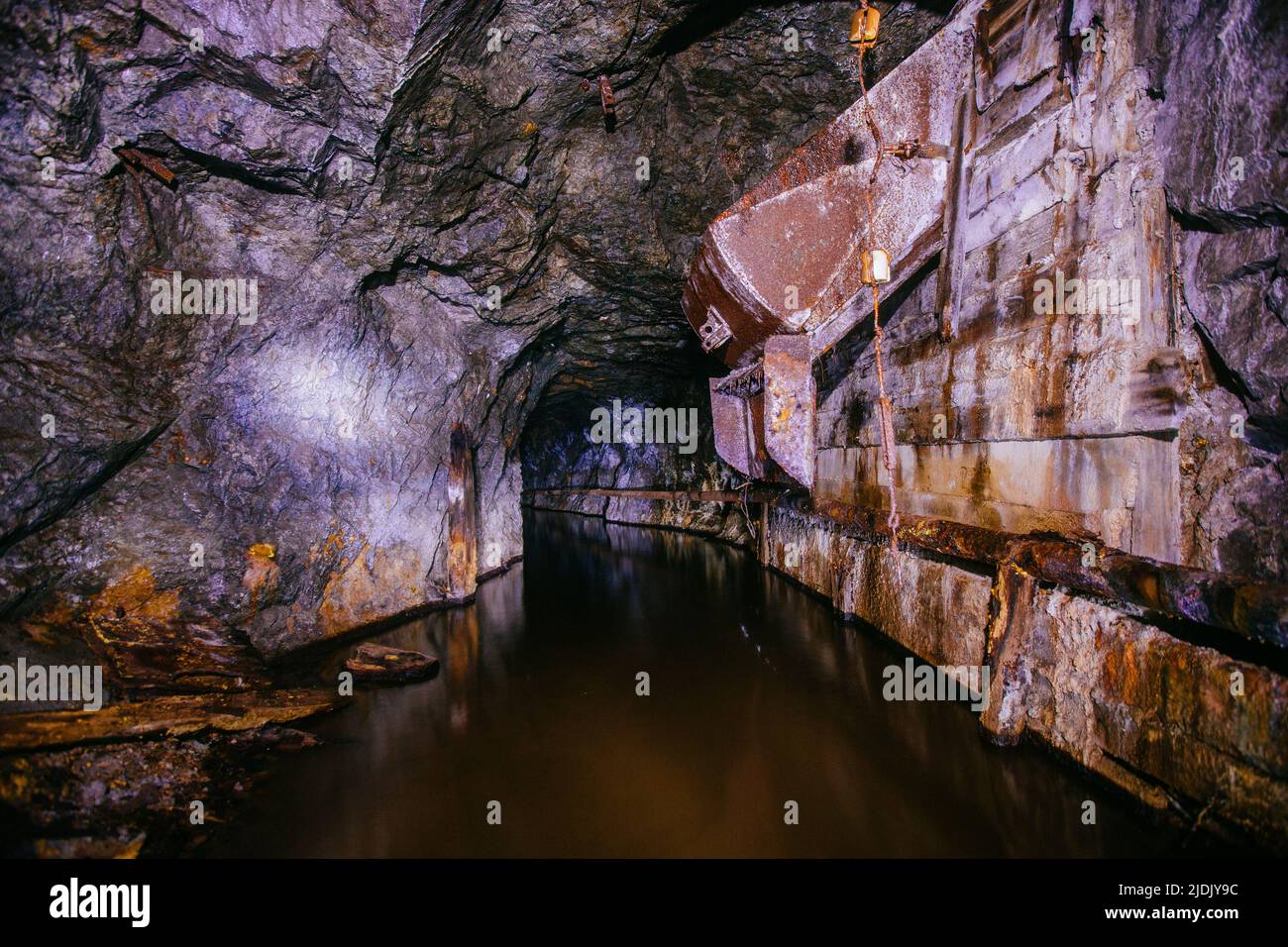 Dark flooded abandoned mine tunnel Stock Photo - Alamy