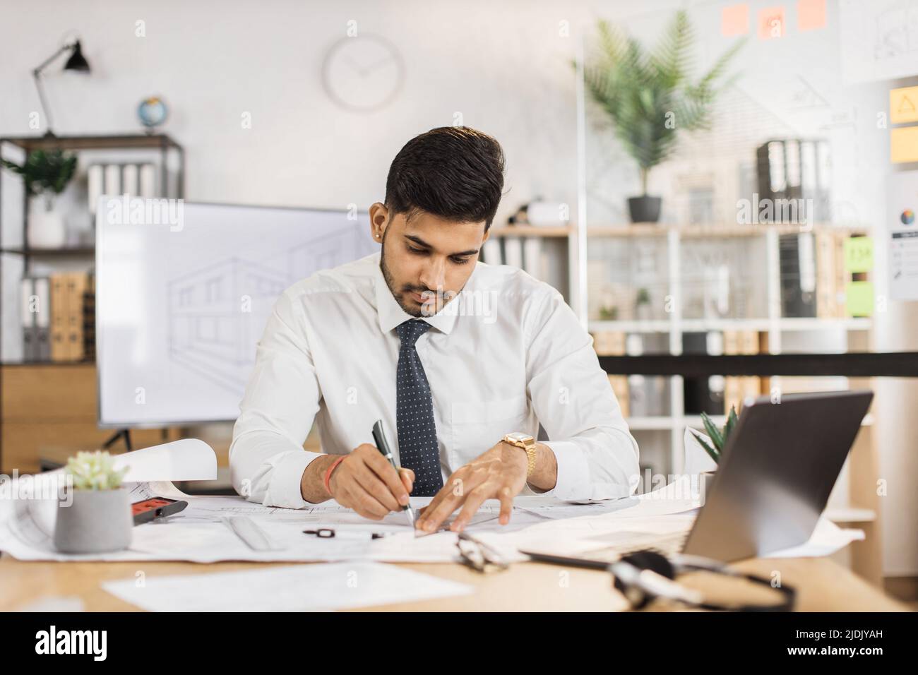 Bearded engineer indian man in yellow helmet and reflective vest ...