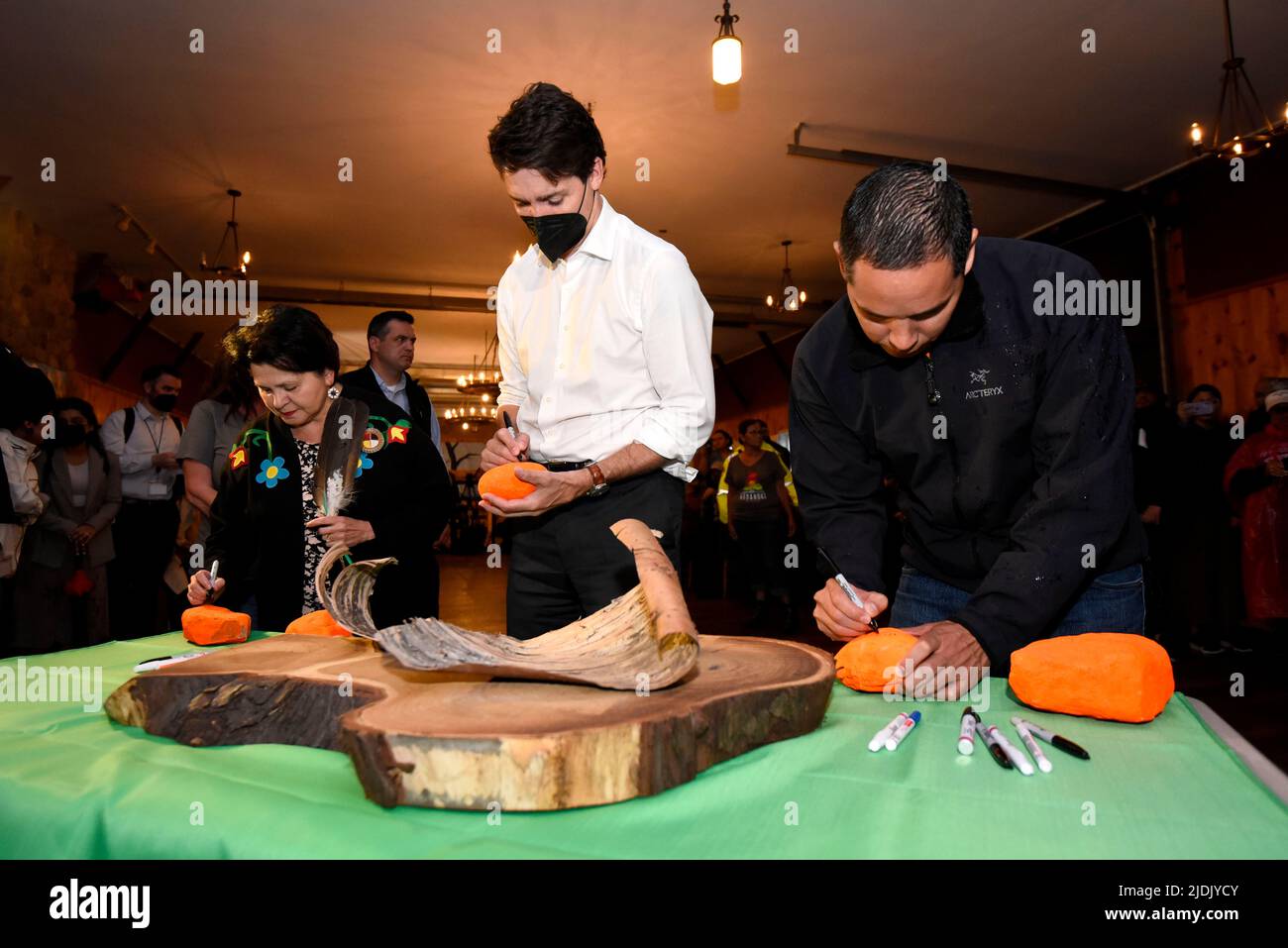 Prime Minister Justin Trudeau joins Elder Claudette Commanda, left, and ...
