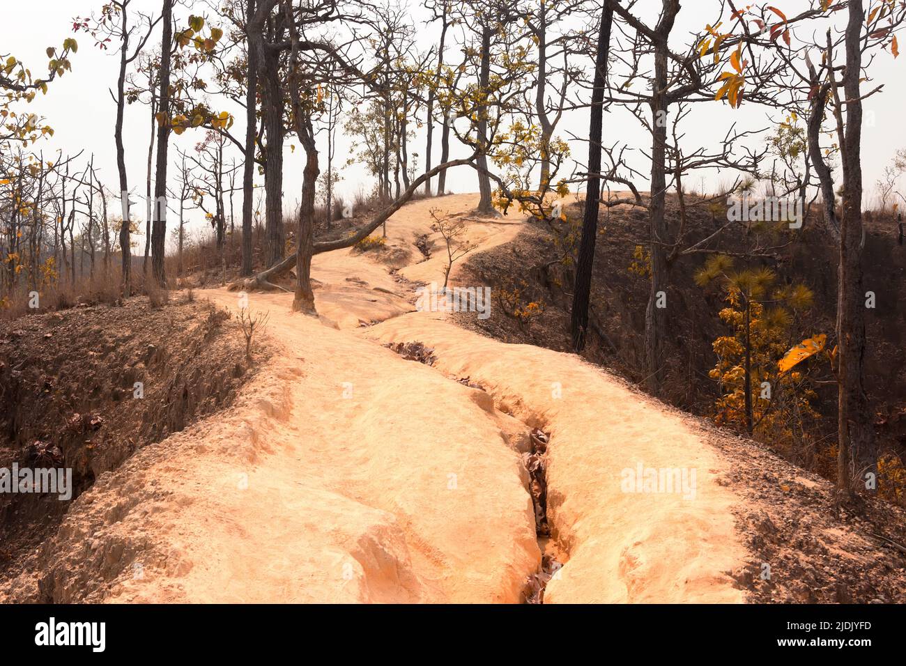 Walker in mountain trail, go along the narrow ridge where the right and ...