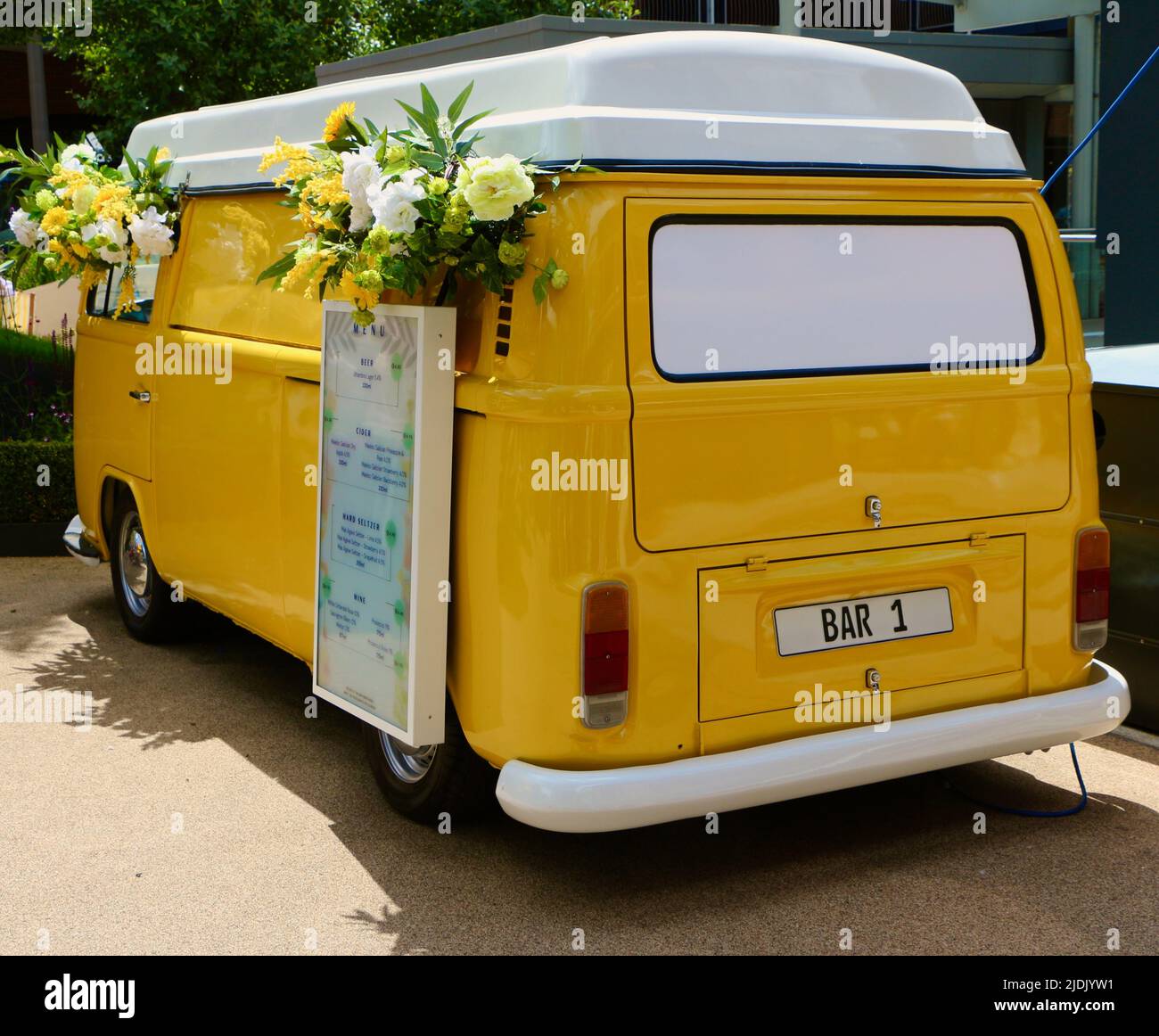 A yellow converted VW camper van used as a fast food stall Gunwharf ...
