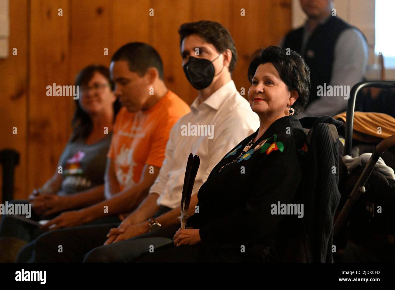 Elder Claudette Commanda sits with Prime Minister Justin Trudeau at a ...