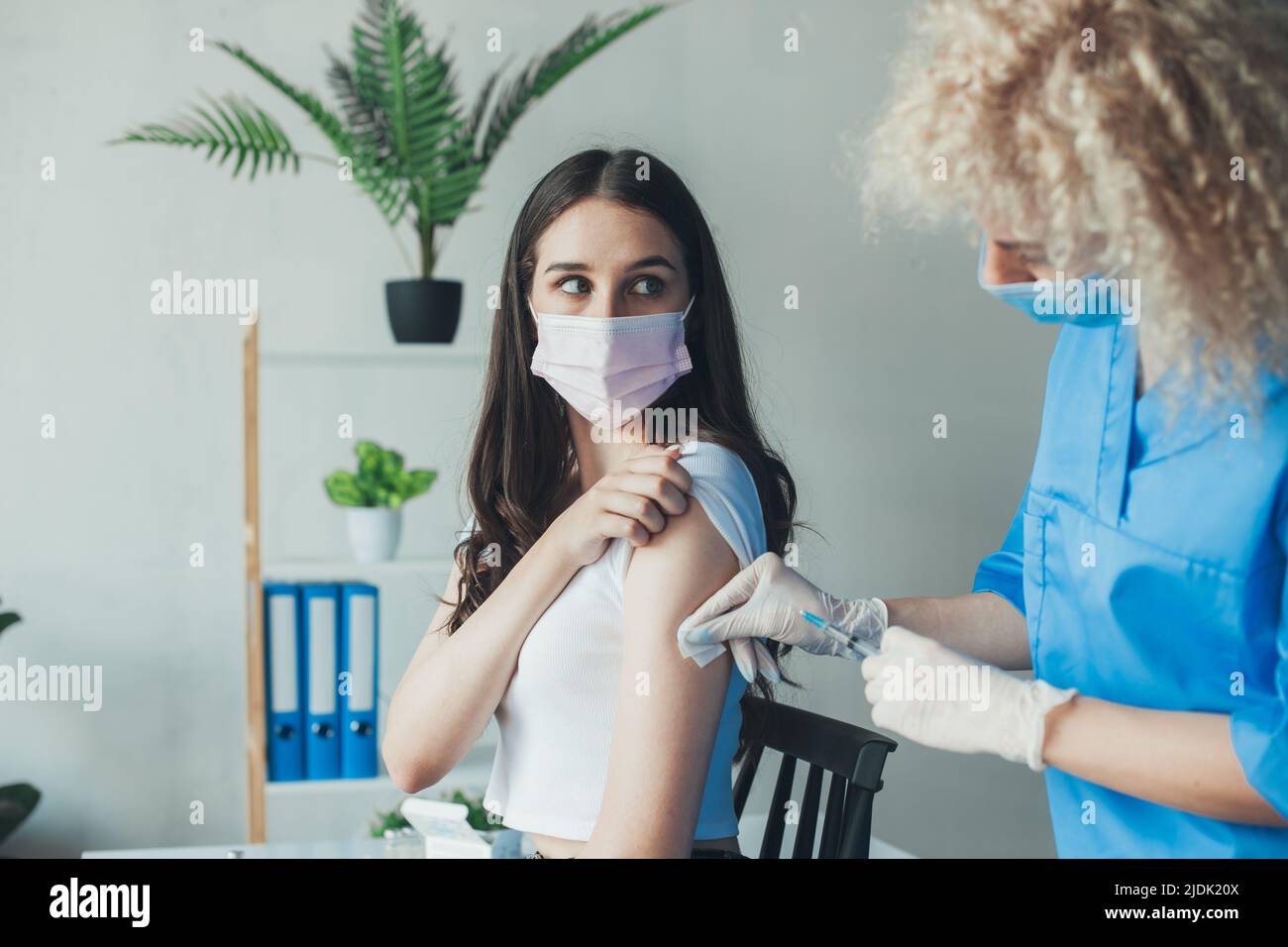 Doctor disinfecting skin on hi-res stock photography and images - Alamy
