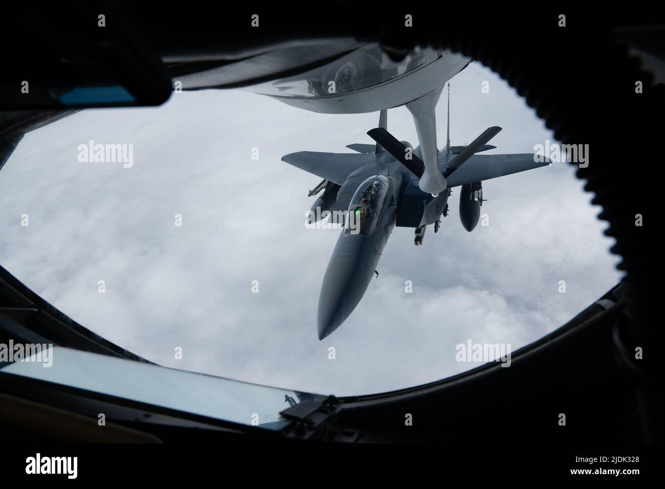 A F-15SG Strike Eagle receives fuel from a KC-135 Stratotanker over the ...