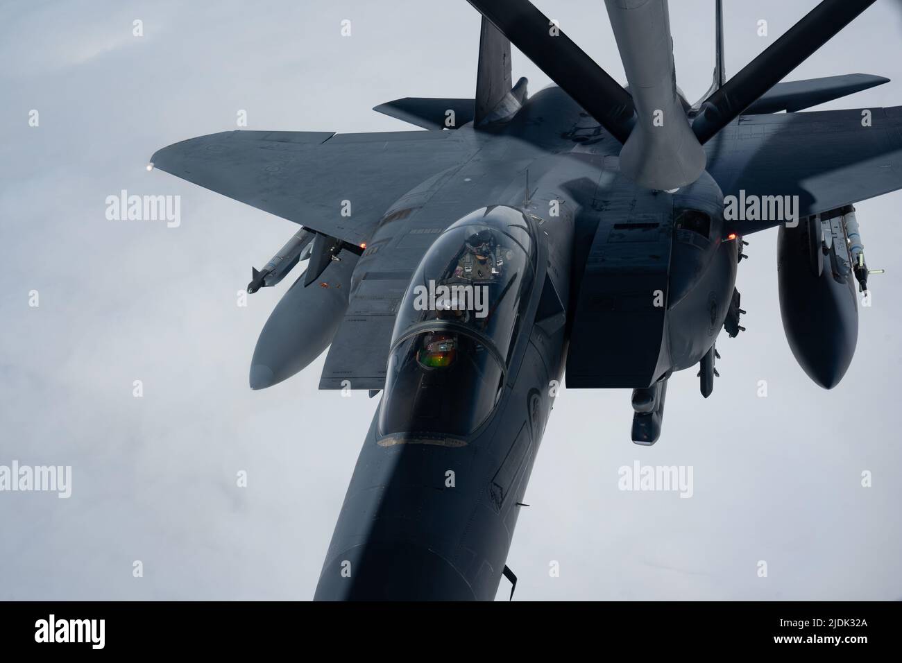 A F-15SG Strike Eagle receives fuel from a KC-135 Stratotanker over the ...