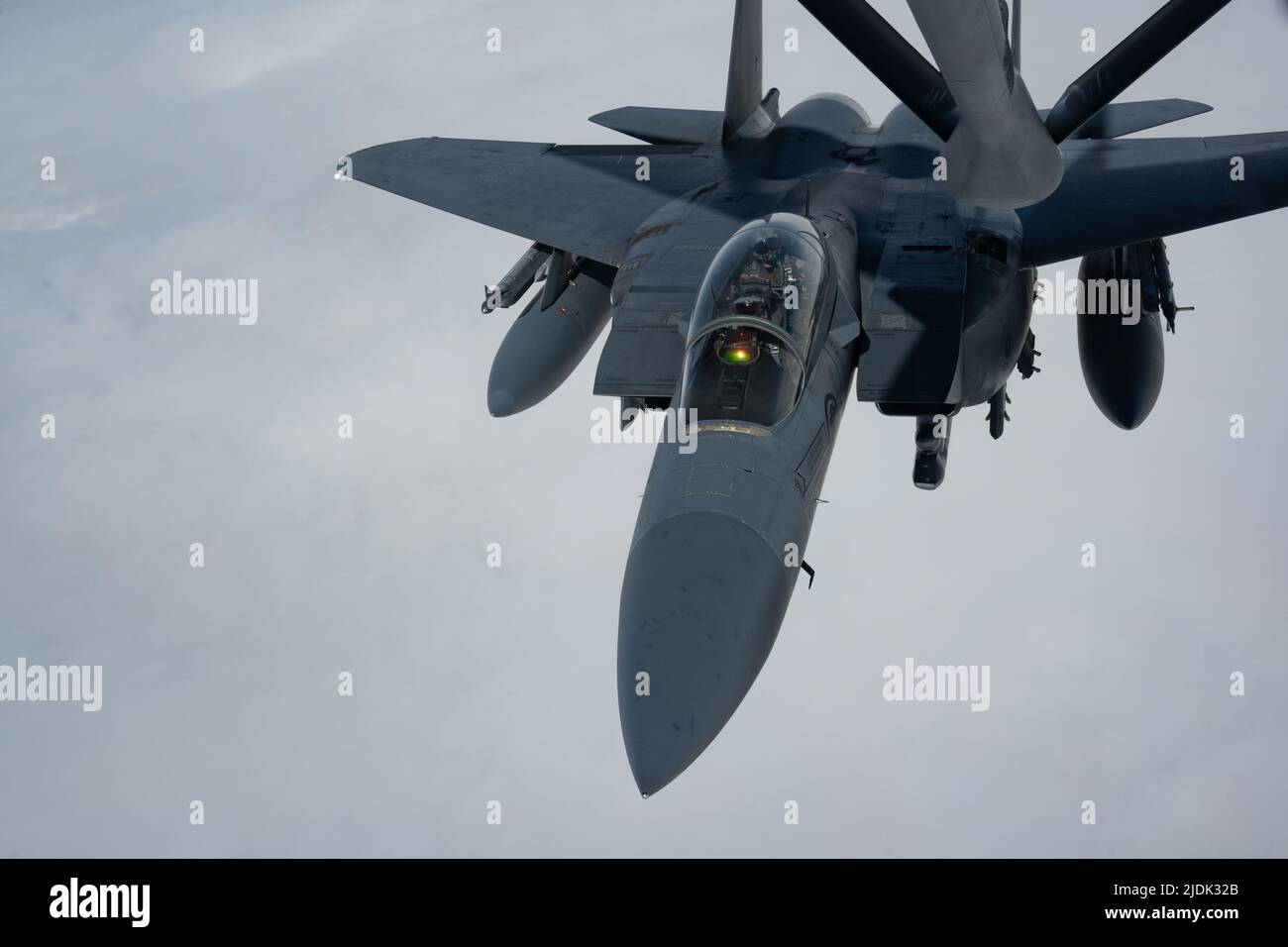 A F-15SG Strike Eagle receives fuel from a KC-135 Stratotanker over the ...