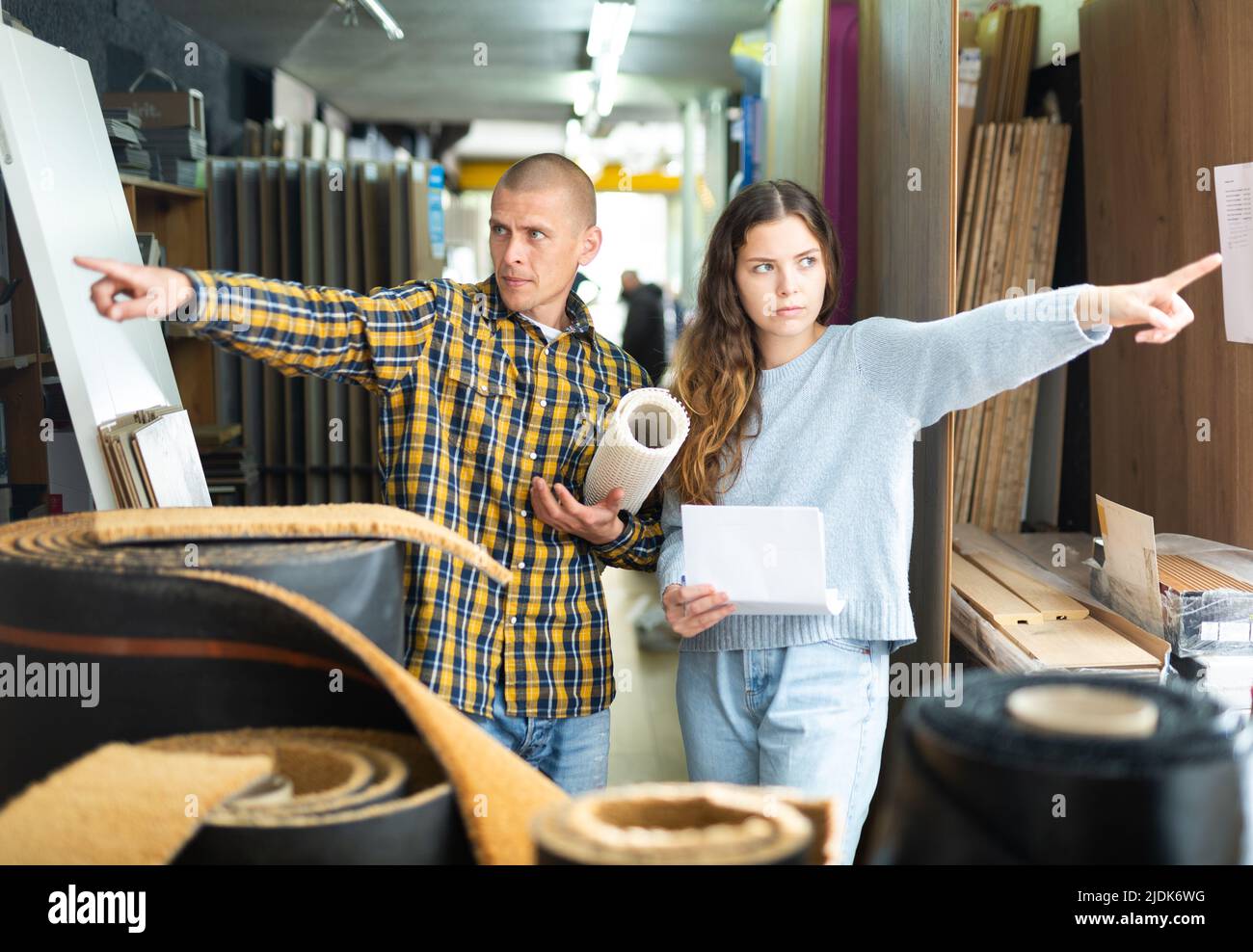 Customers shopping in building store and pointing to something Stock ...