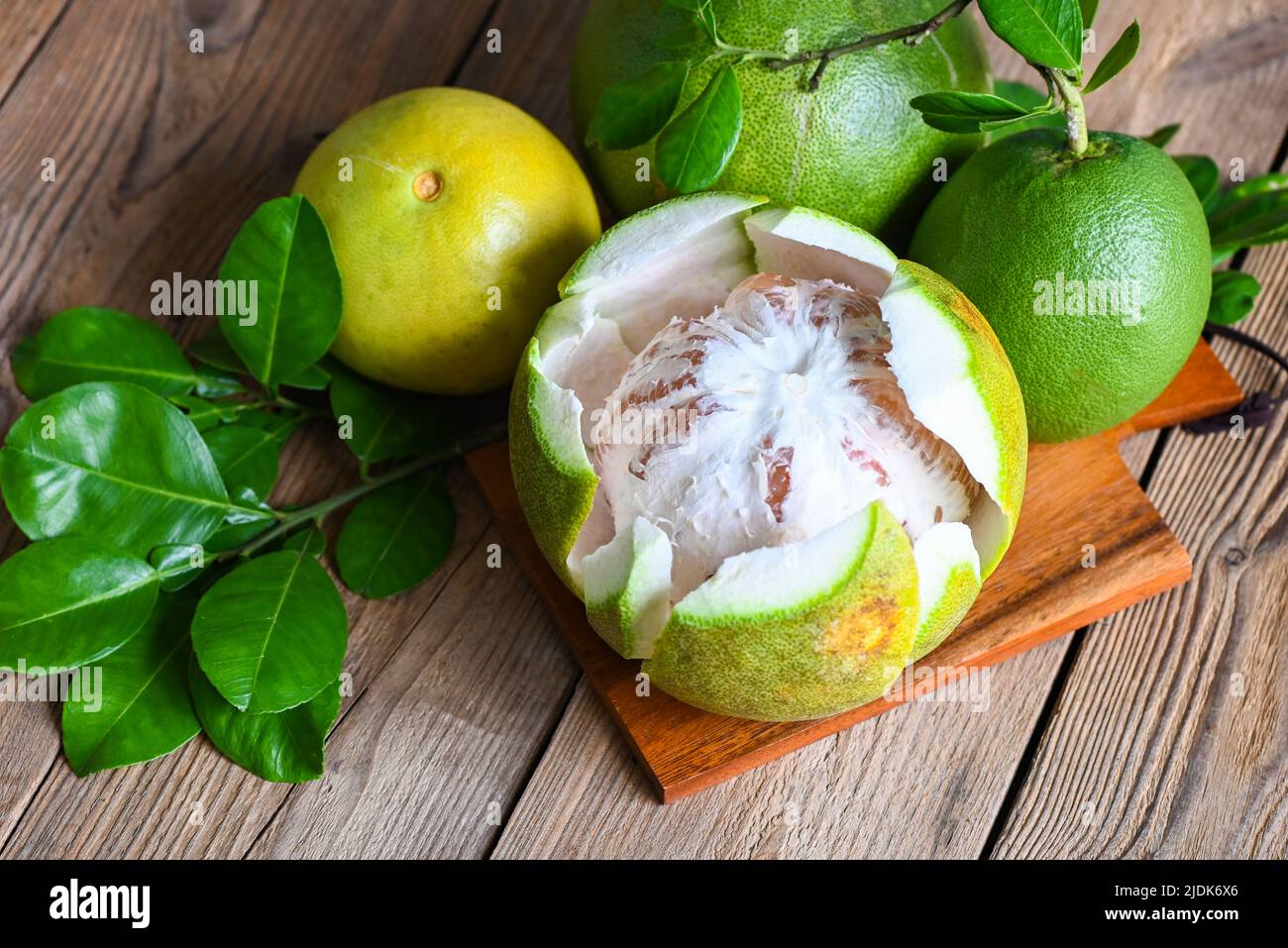 Fresh green pomelo peeled and leaf frome pomelo tree , pomelo fruit on ...