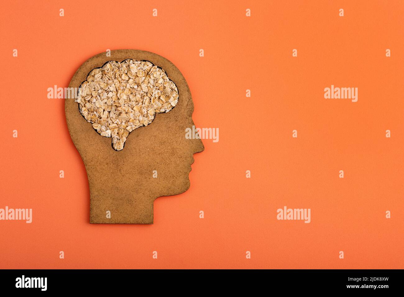 Avena sativa - Oat flakes in the brain shaped bowl Stock Photo - Alamy