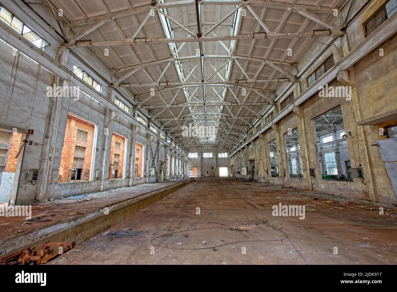 Interior of abandoned steel frame workshop factory building in ...