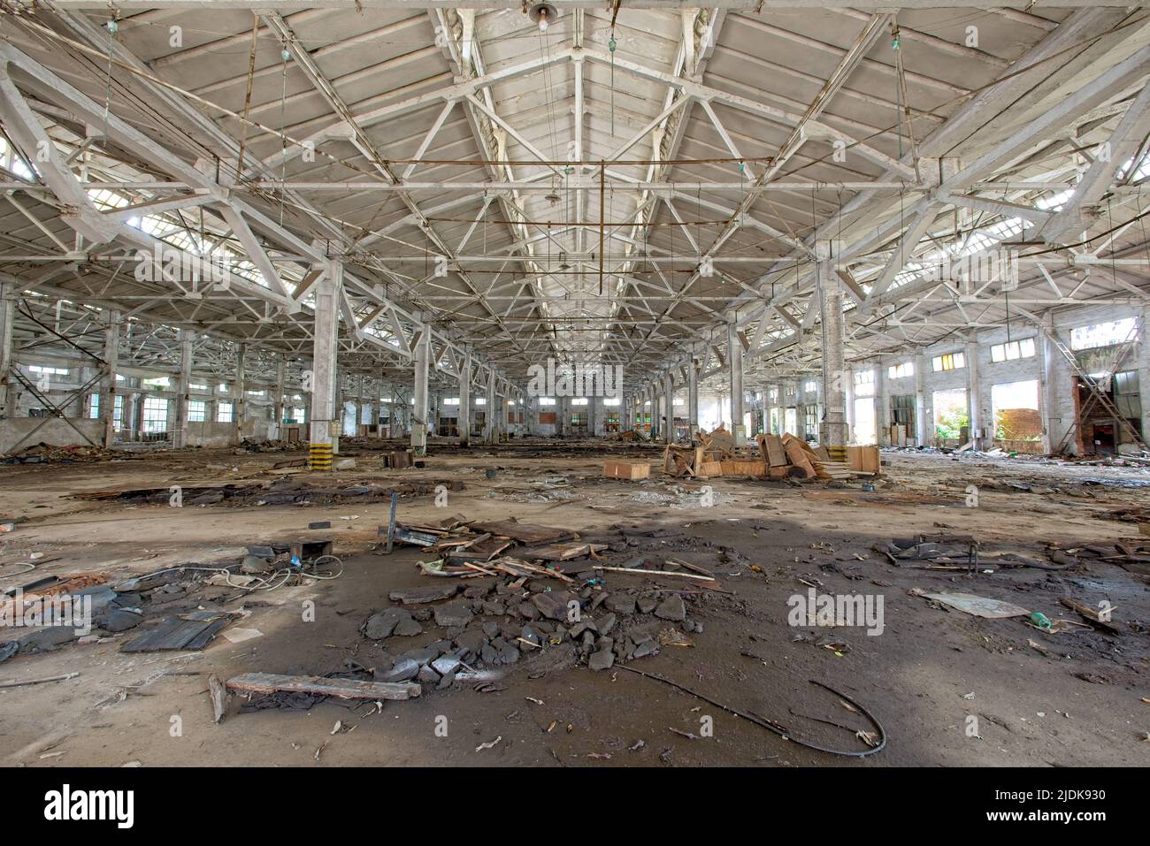 Interior of abandoned steel frame workshop factory building in ...