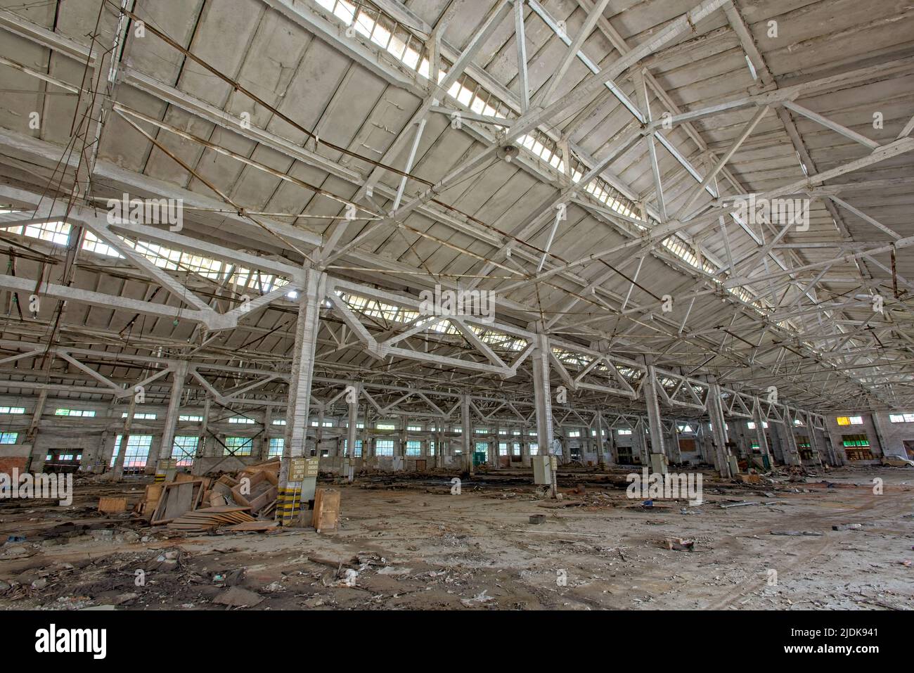 Interior of abandoned steel frame workshop factory building in ...