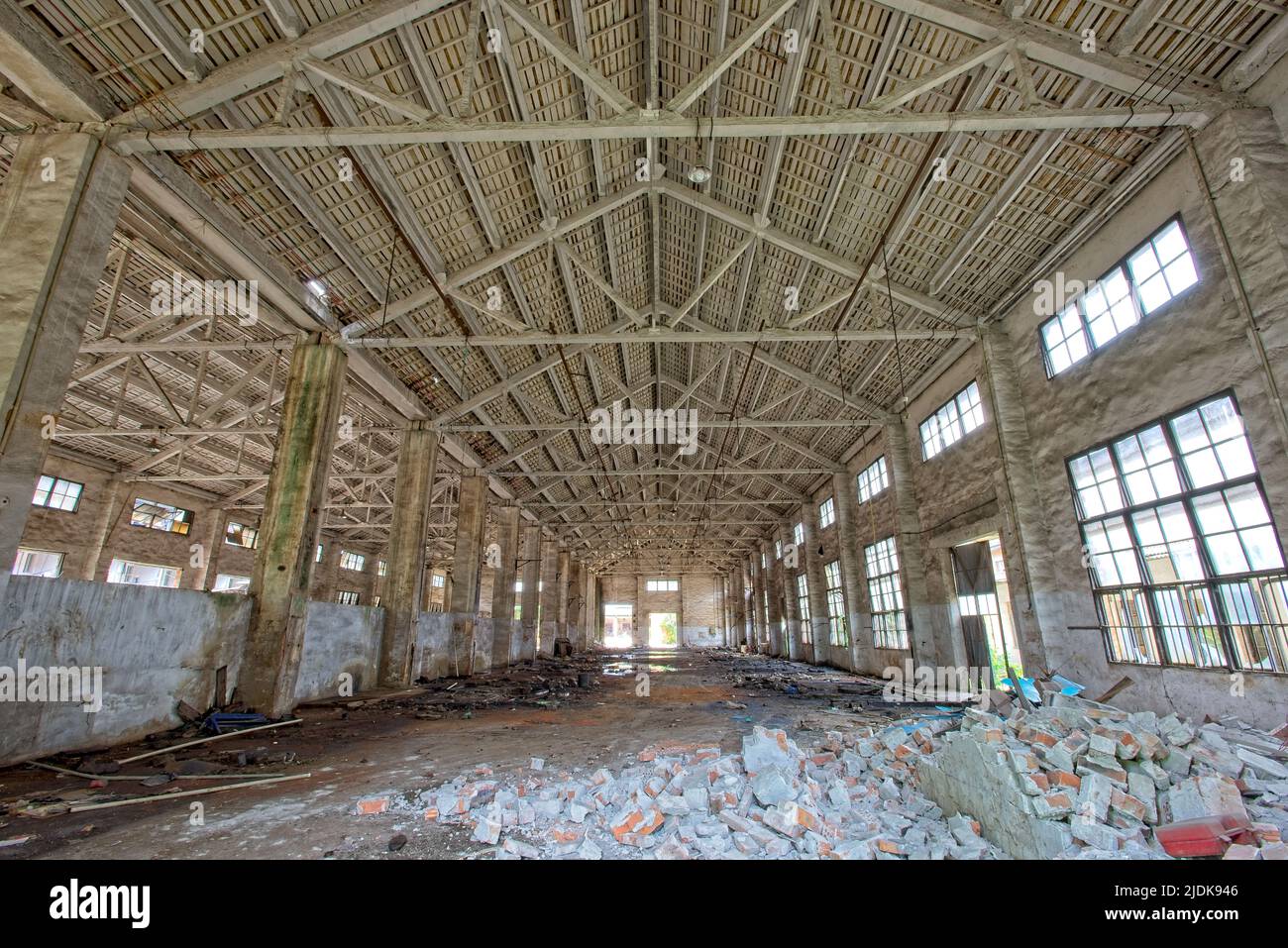 Interior of abandoned steel frame workshop factory building in ...