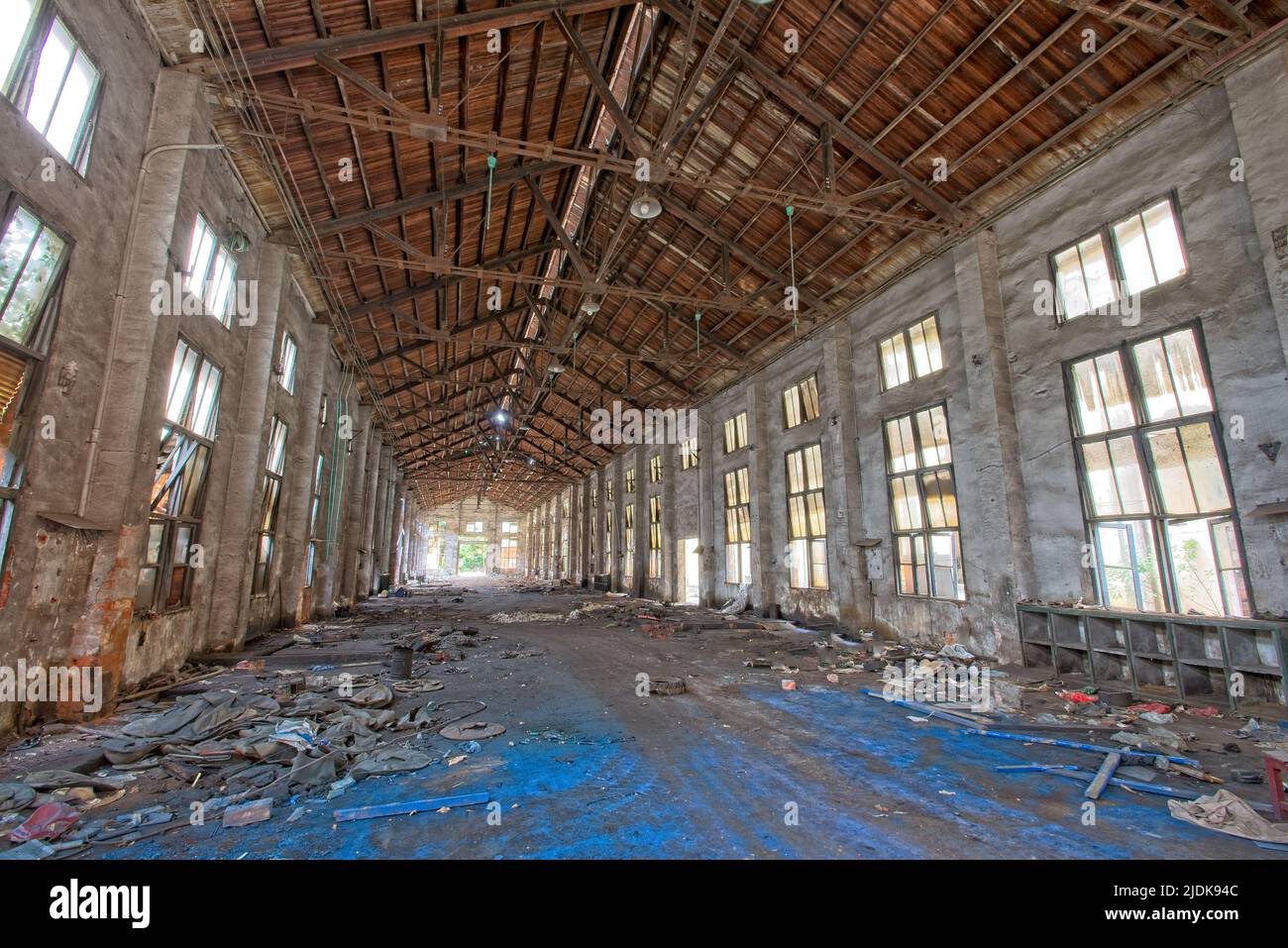 Interior of abandoned steel frame workshop factory building in ...