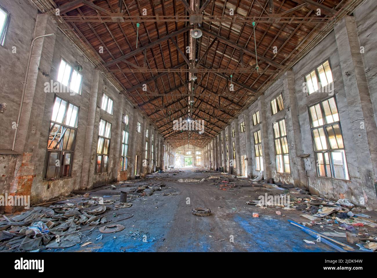 Interior of abandoned steel frame workshop factory building in ...