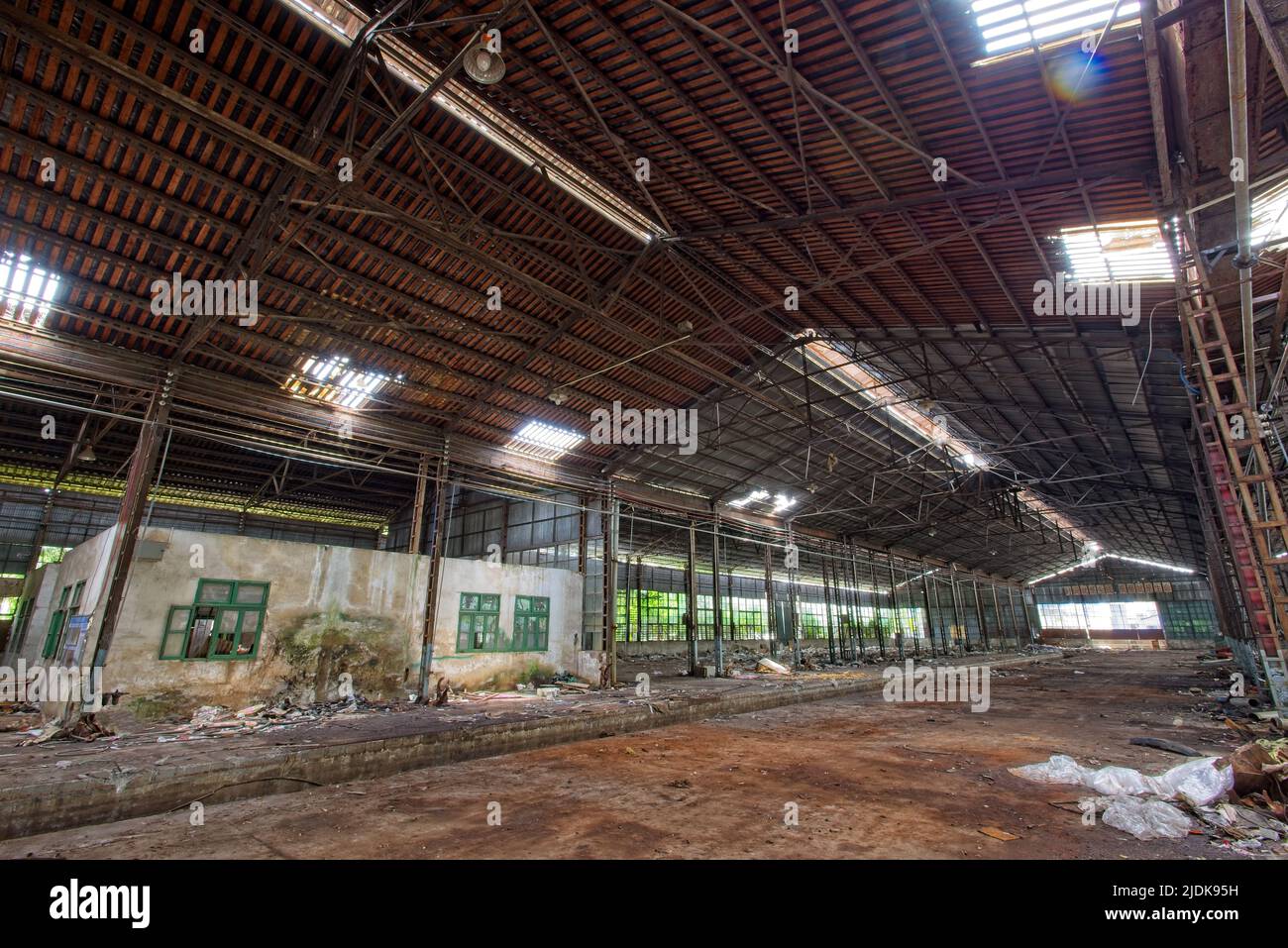 Interior of abandoned steel frame workshop factory building in ...