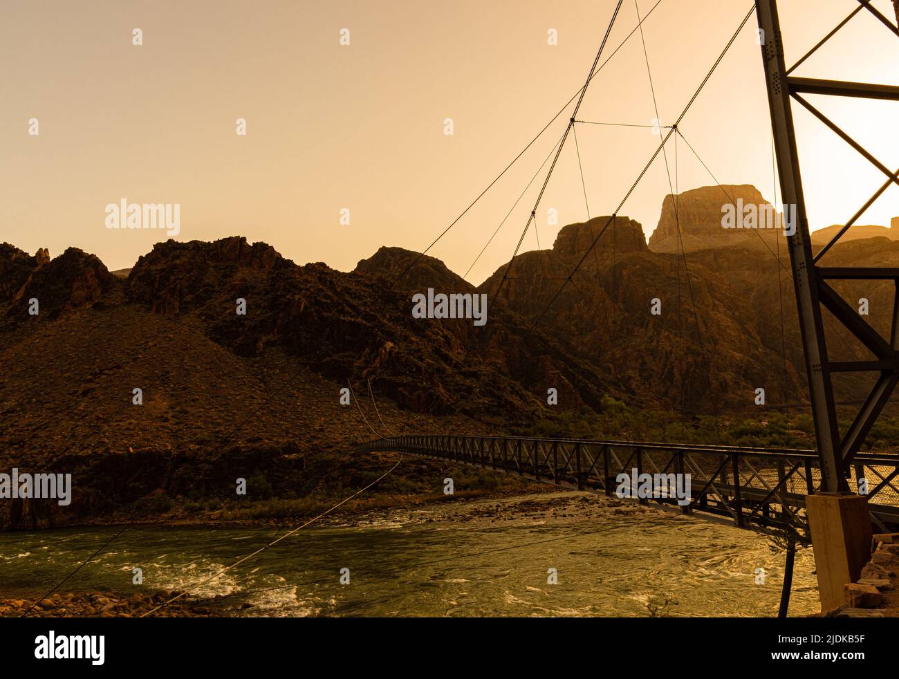 Golden Light of Sunrise on The Silver Bridge That Spans The Colorado ...