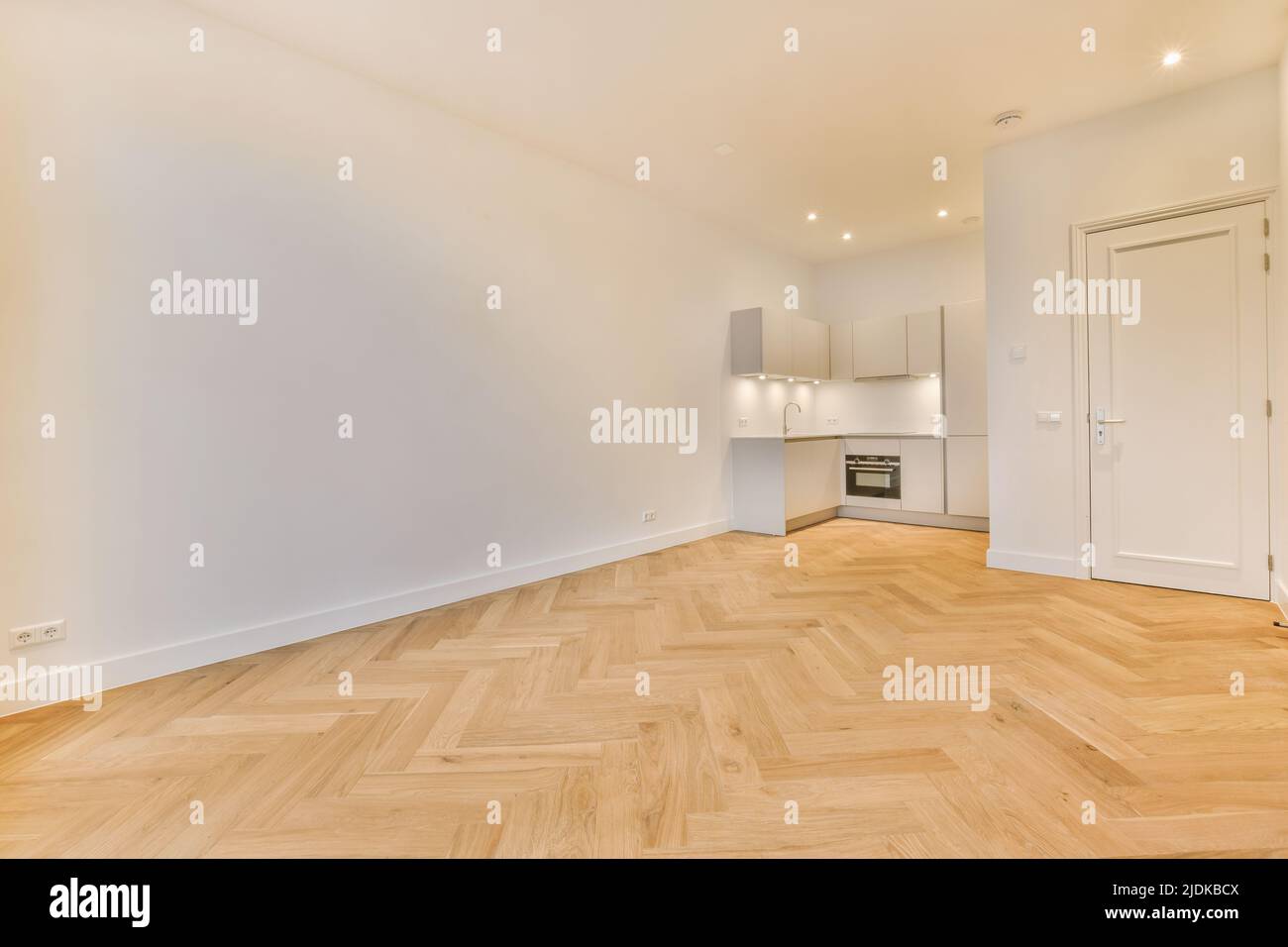 Empty white kitchen interior with backlight and wooden parquet floor ...