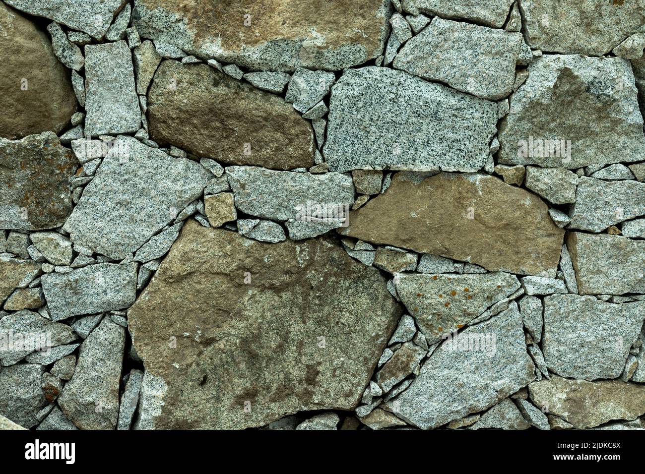 Stone wall for background or backdrop uneven cracked real stone wall ...