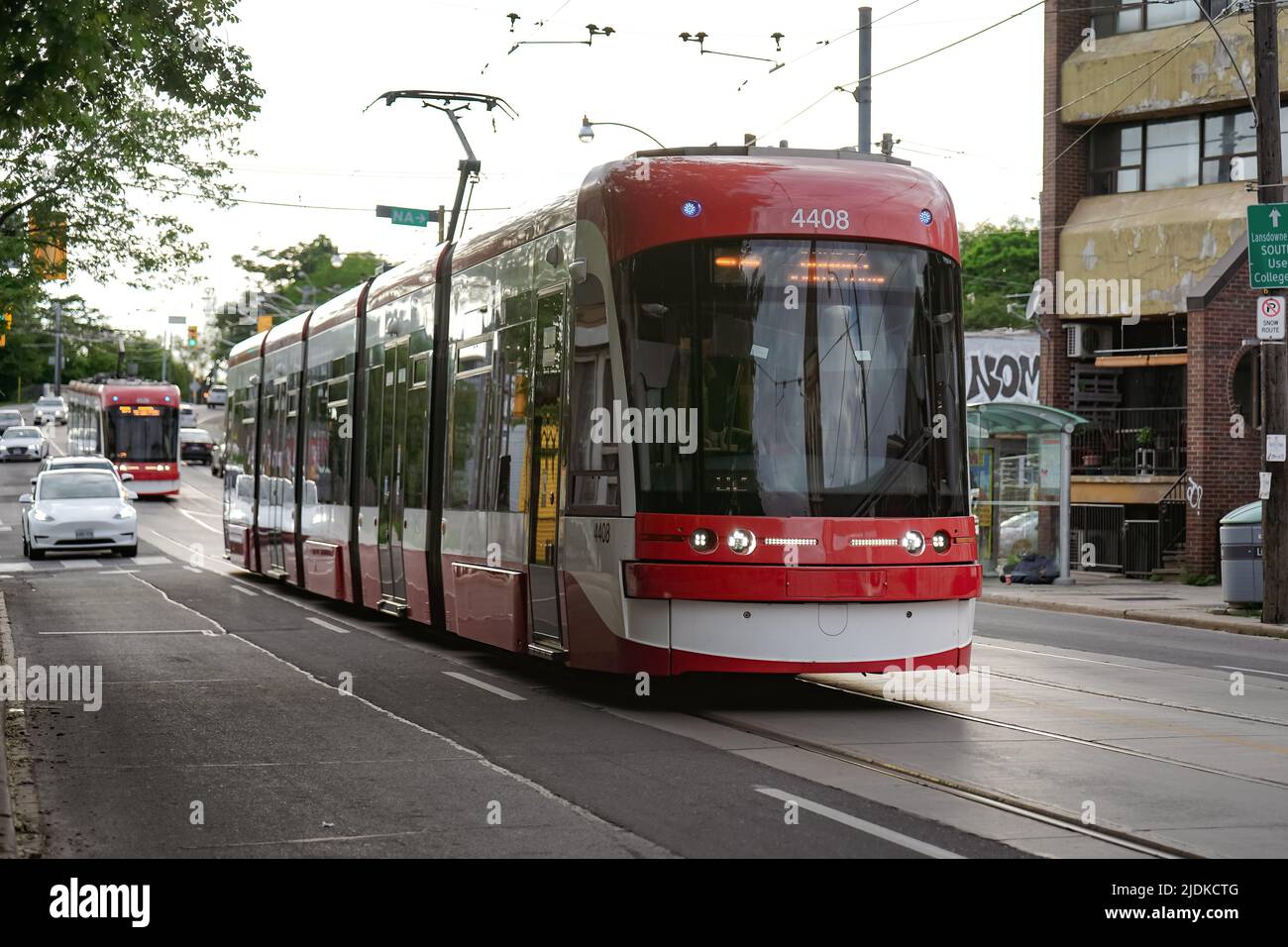 Toronto public streetcar tram outdoor red white Stock Photo - Alamy