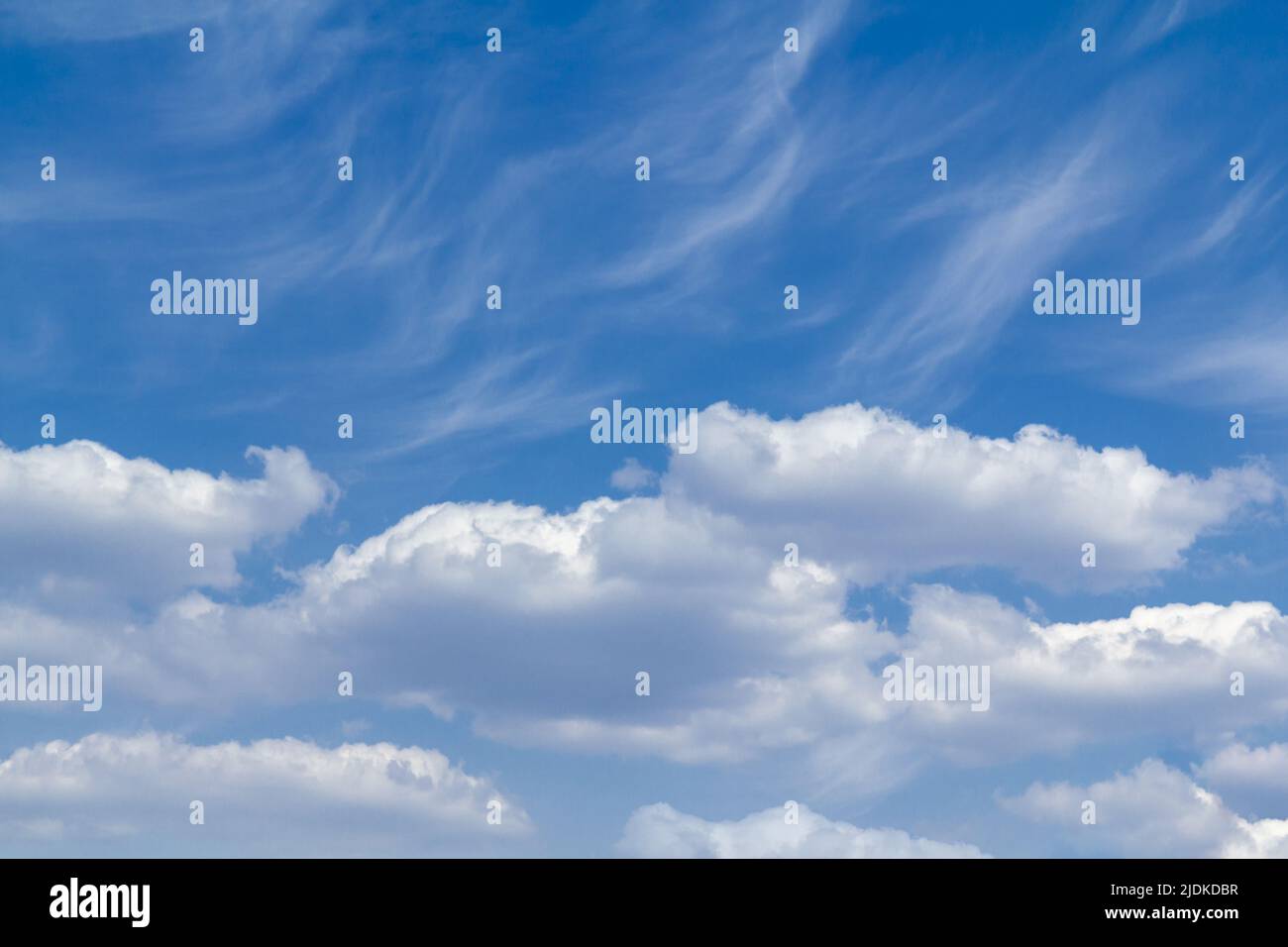 The background is in the form of two different types of natural clouds ...