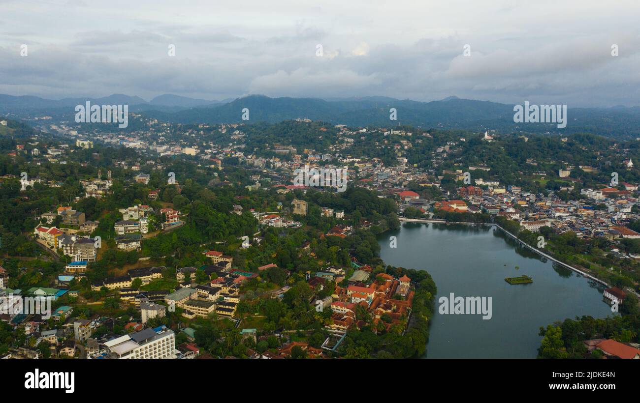 The city of Kandy is located among the mountain peaks with a tropical ...